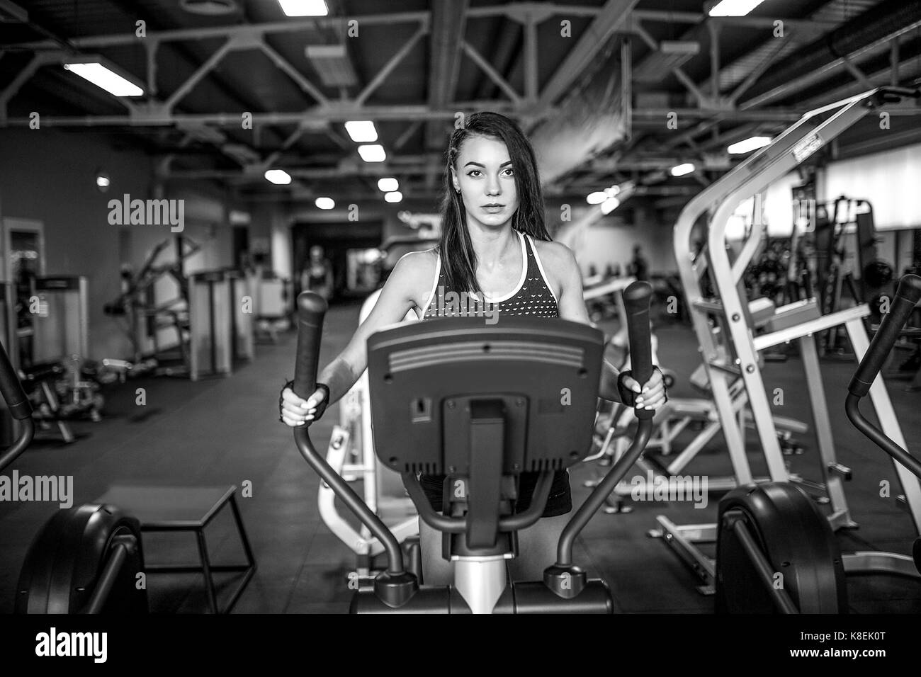 Young fitness woman doing cardio exercises at the gym running on a ...