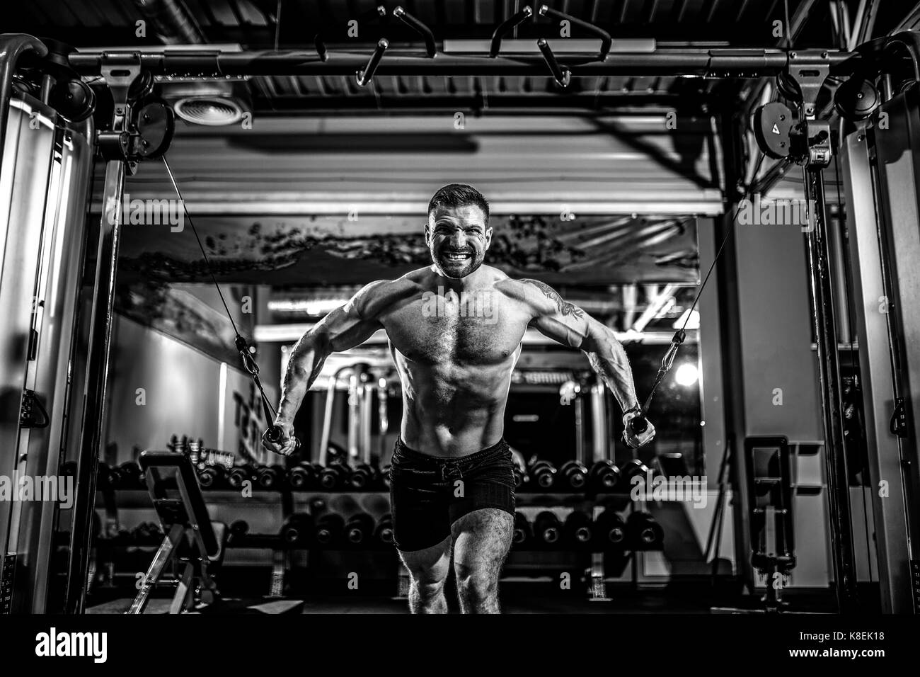 Bodybuilder exercises in gym Black and White Stock Photos & Images - Alamy
