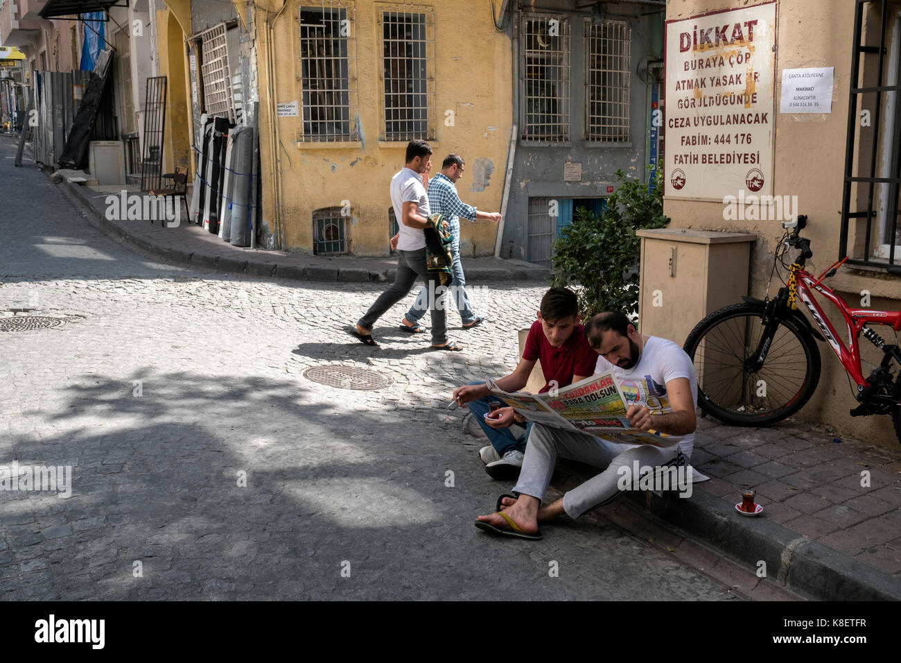 Reading a newspaper, Istanbul Stock Photo - Alamy