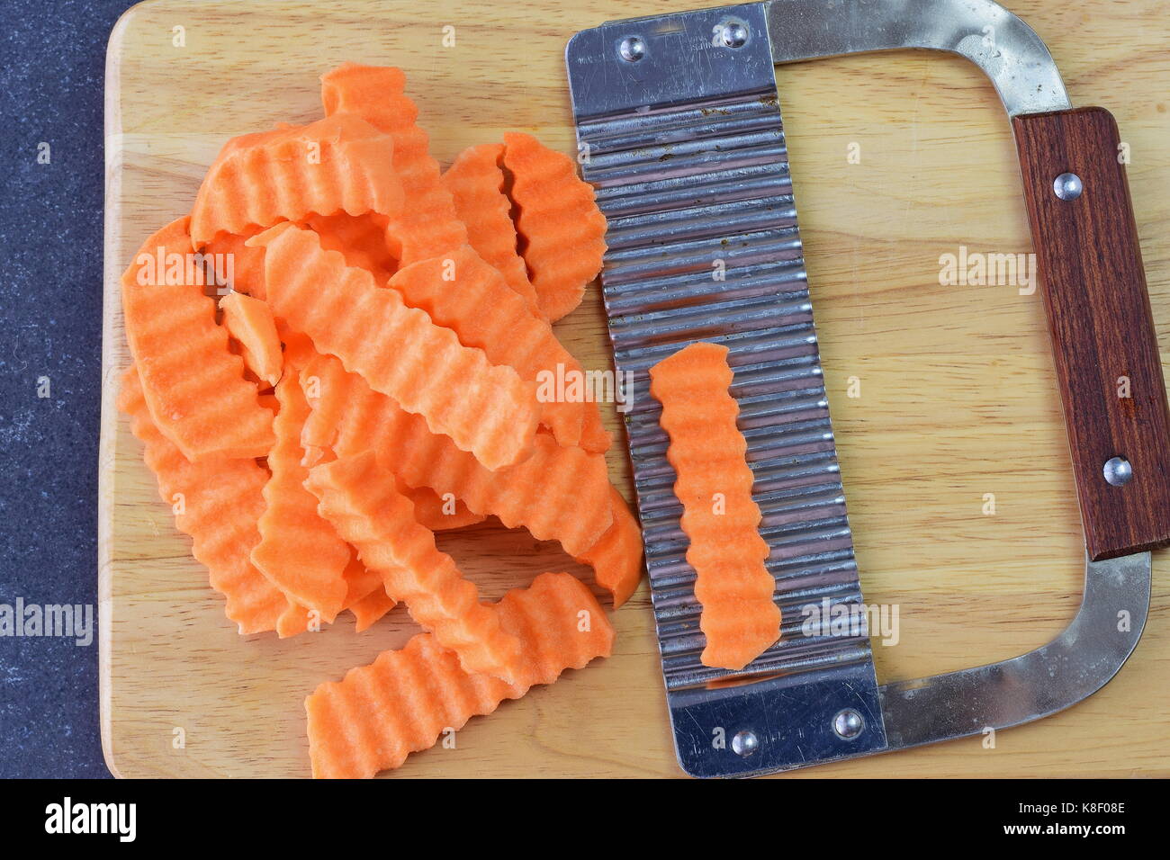 Yams, sweet potato cut in pieces with a special knife with ribs on a ...