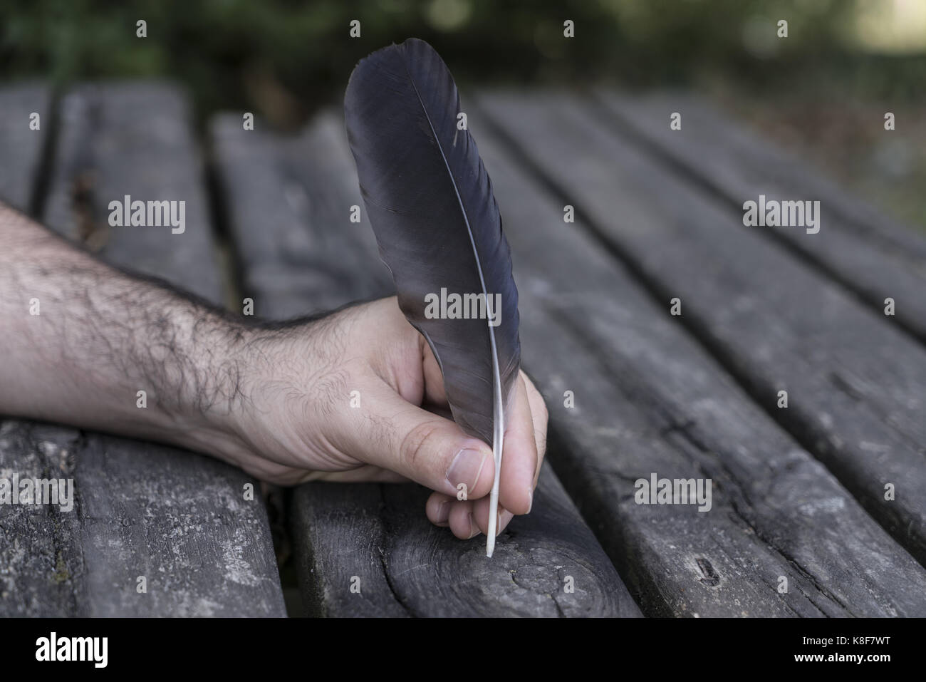 Hand writing with pen and inkwell Stock Photo - Alamy