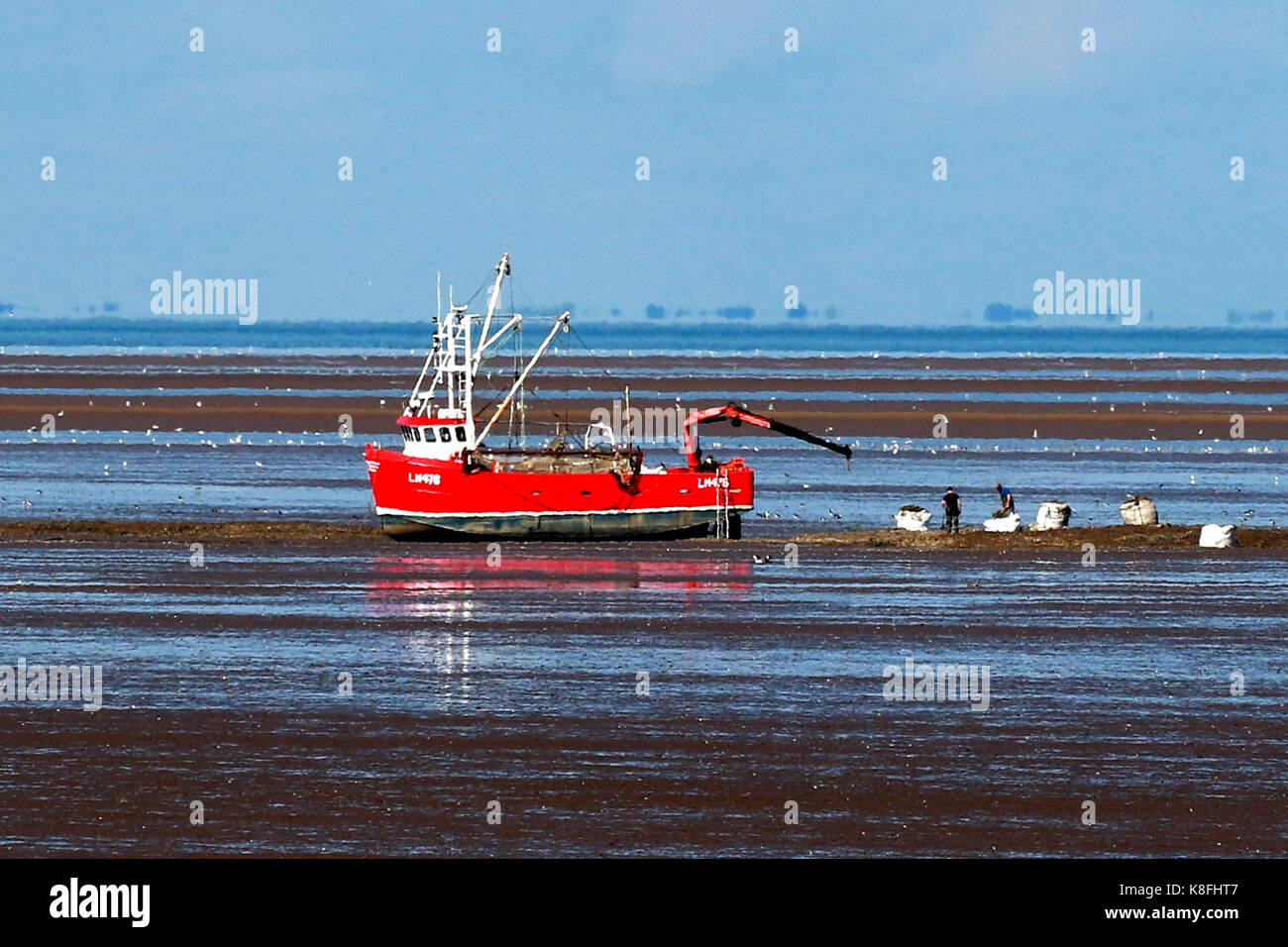 Heacham, UK. 19th Sep, 2017. UK Weather. A fishing boat prepares to ...