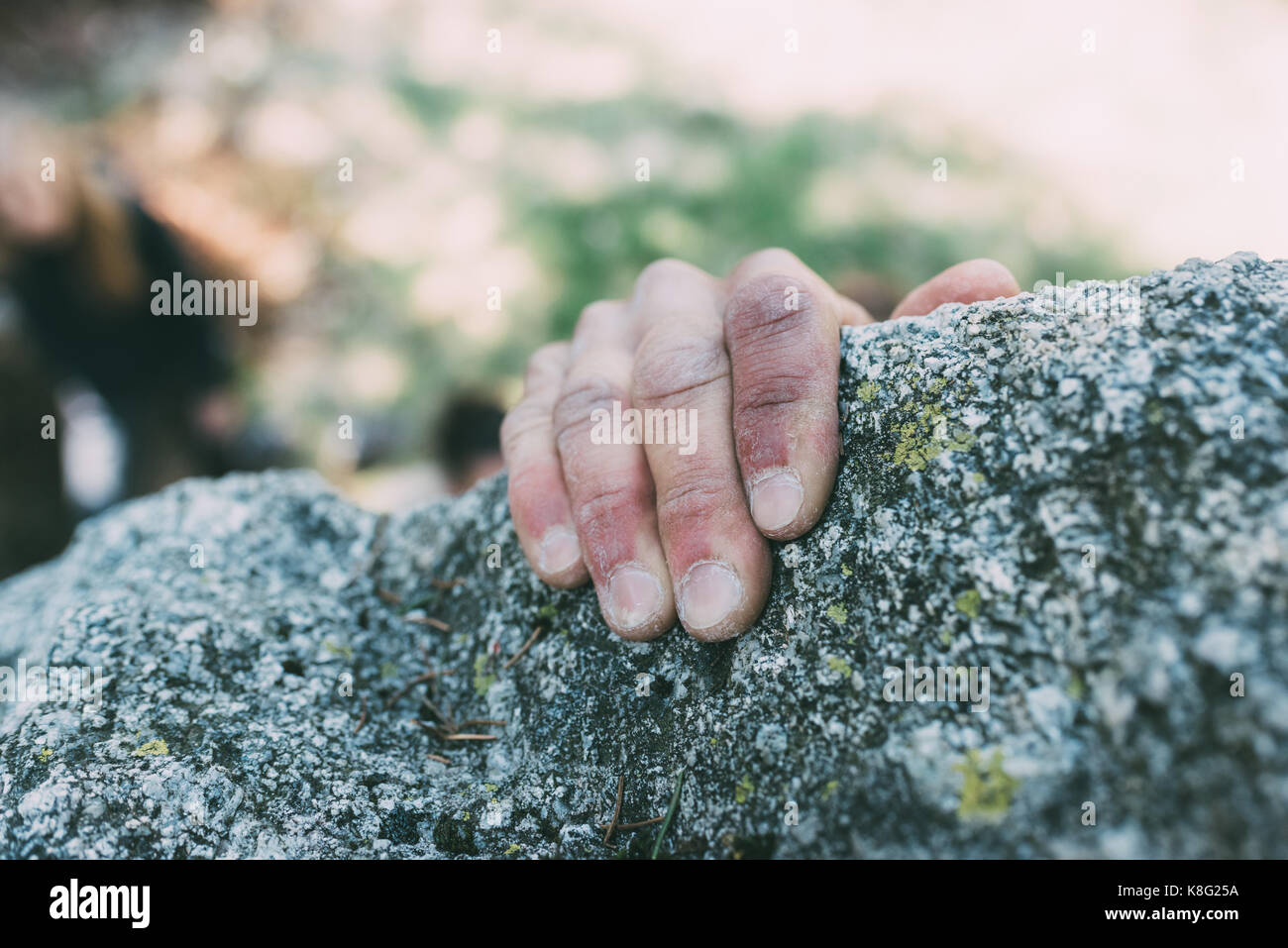 Hand of male boulderer gripping boulder edge, Lombardy, Italy Stock ...
