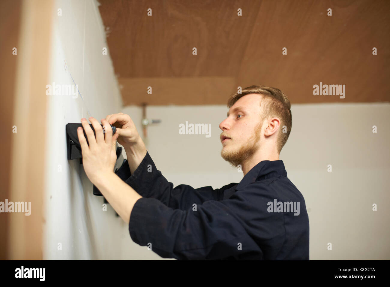 Student learning how to do building work Stock Photo - Alamy