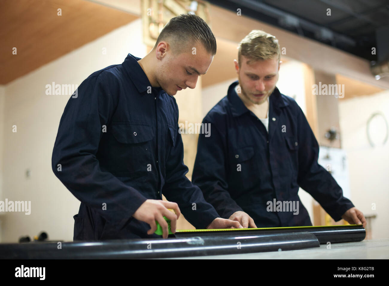 Students learning how to do building work Stock Photo - Alamy