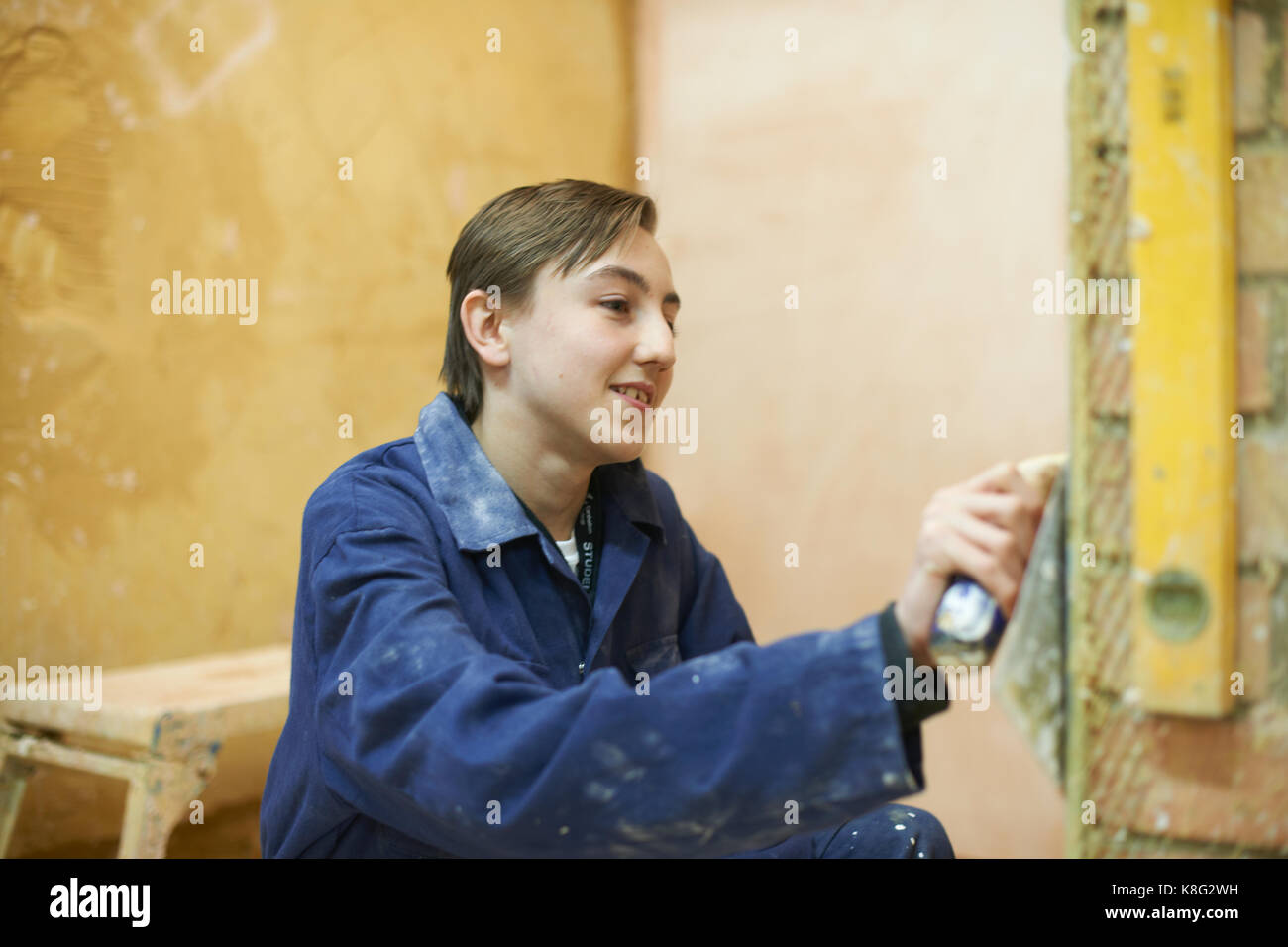 Student learning how to do building work Stock Photo - Alamy