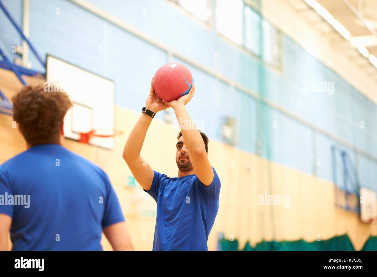 Friends playing basketball Stock Photo - Alamy
