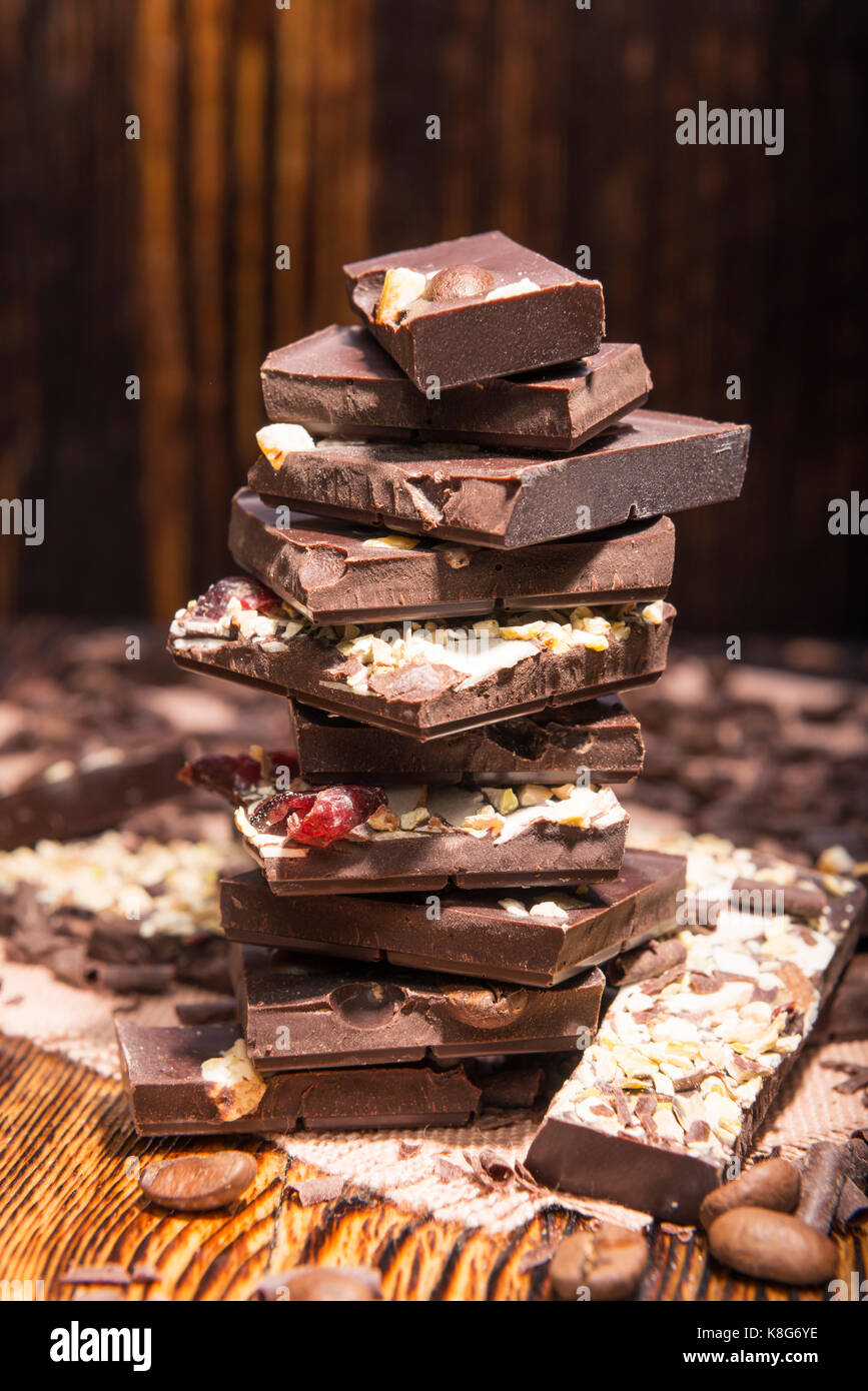 stack of chocolate on a wooden background Stock Photo - Alamy