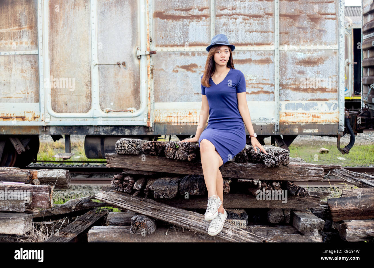 asian thai lady model post action tourism hold old train in dark clound ...