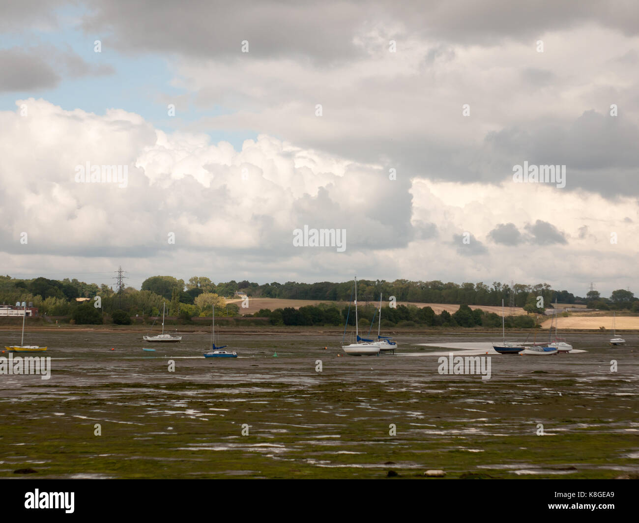 estuary scene in manningtree with moored boats tide clouds landscape ...