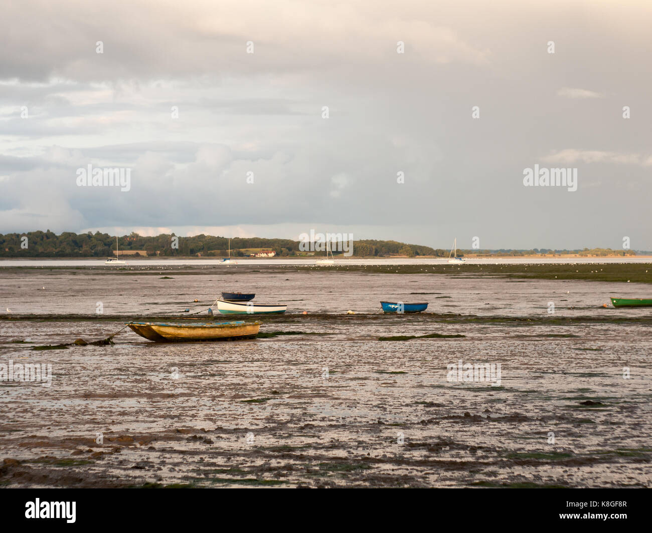 estuary scene in manningtree with moored boats tide clouds landscape ...