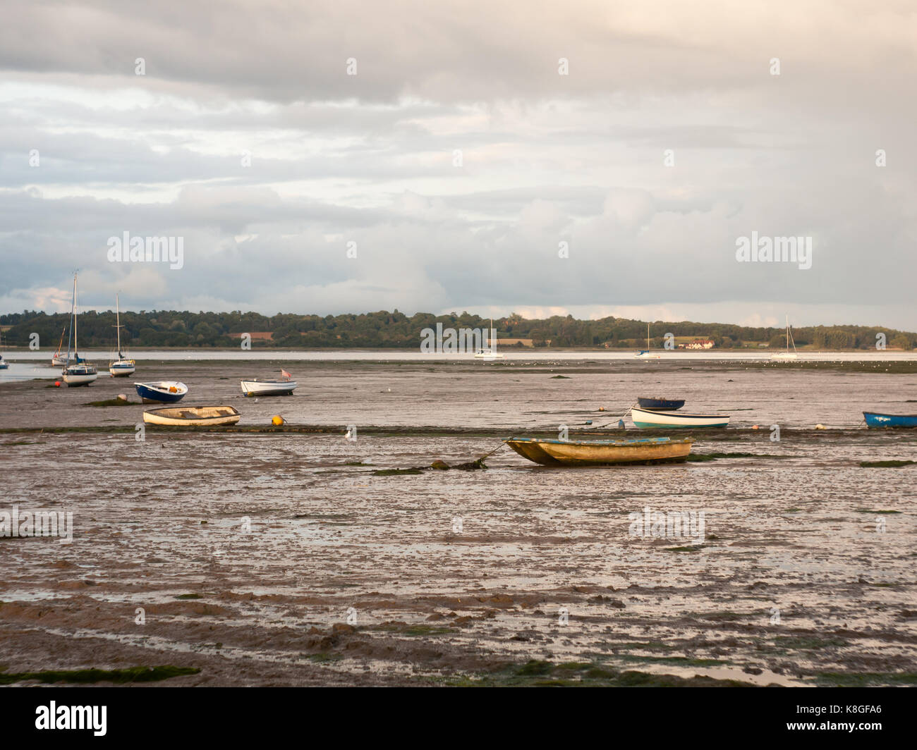 estuary scene in manningtree with moored boats tide clouds landscape ...