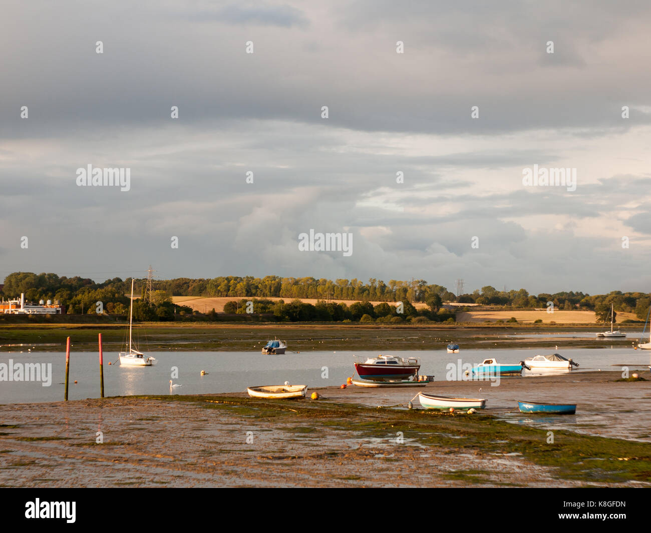 estuary scene in manningtree with moored boats tide clouds landscape ...