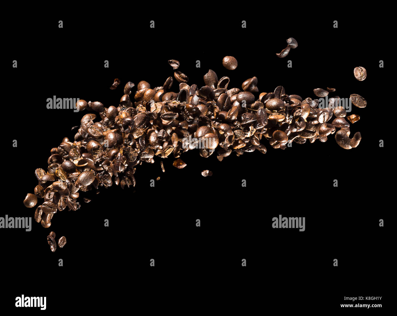 falling coffee beans on a black background Stock Photo - Alamy