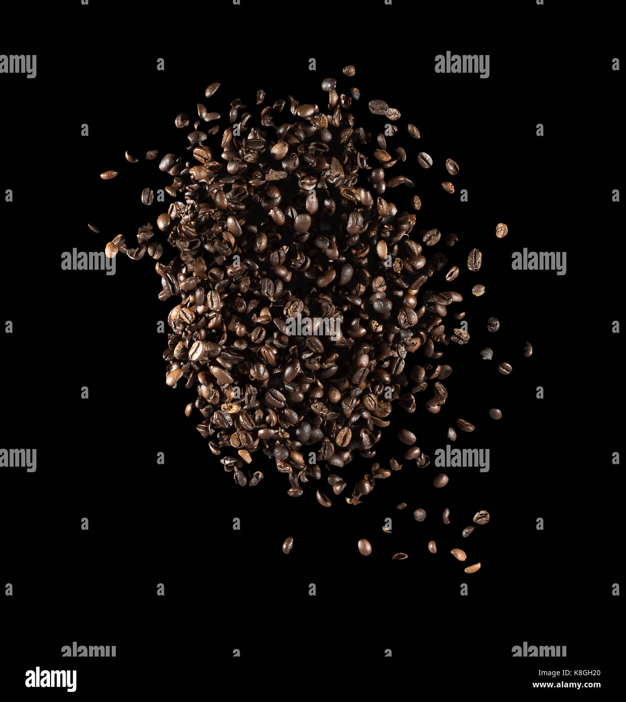 falling coffee beans on a black background Stock Photo - Alamy