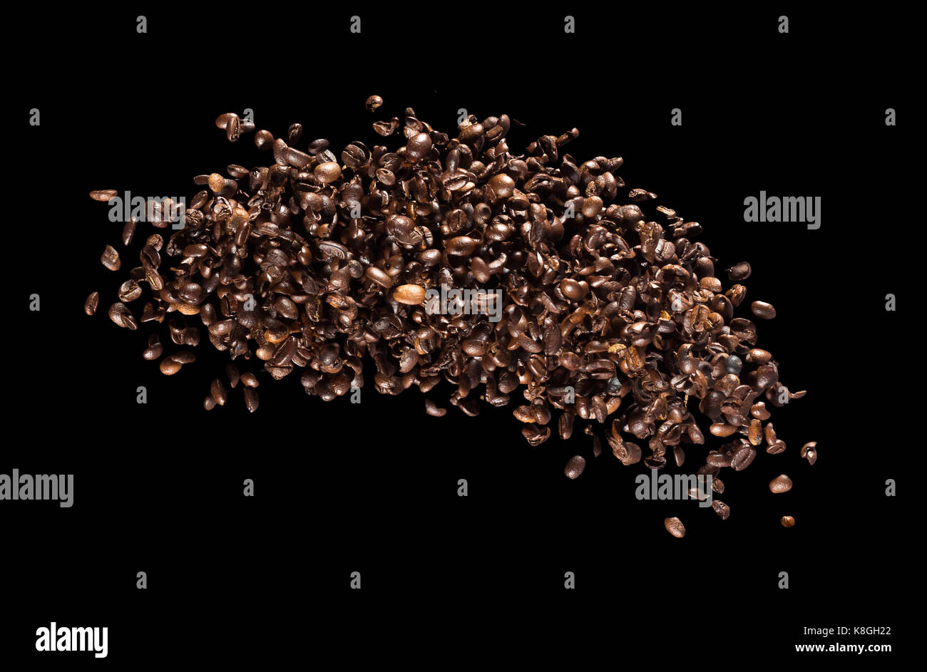 falling coffee beans on a black background Stock Photo - Alamy