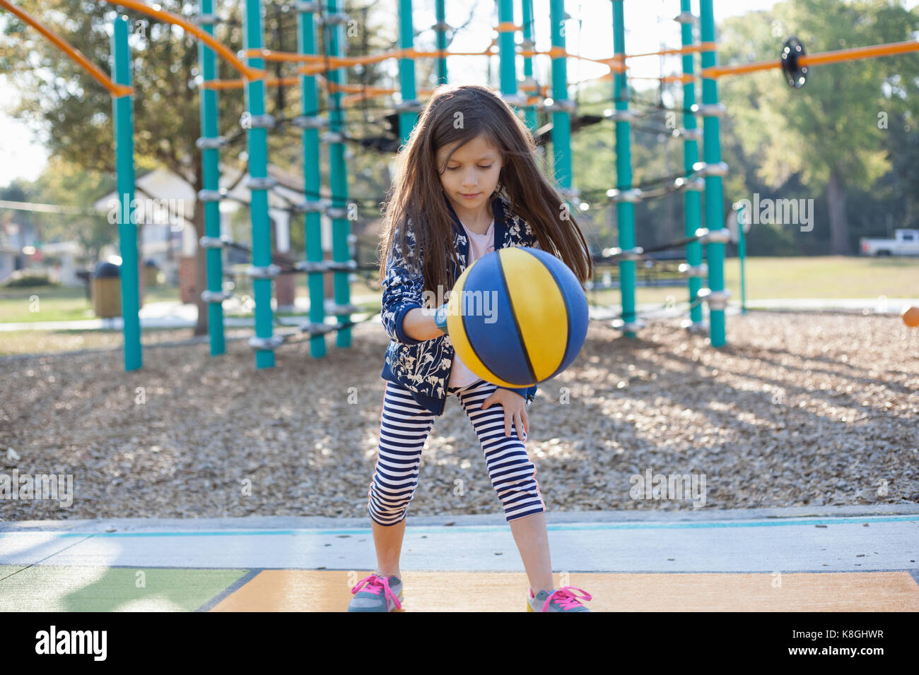 Child bouncing basketball hi-res stock photography and images - Alamy