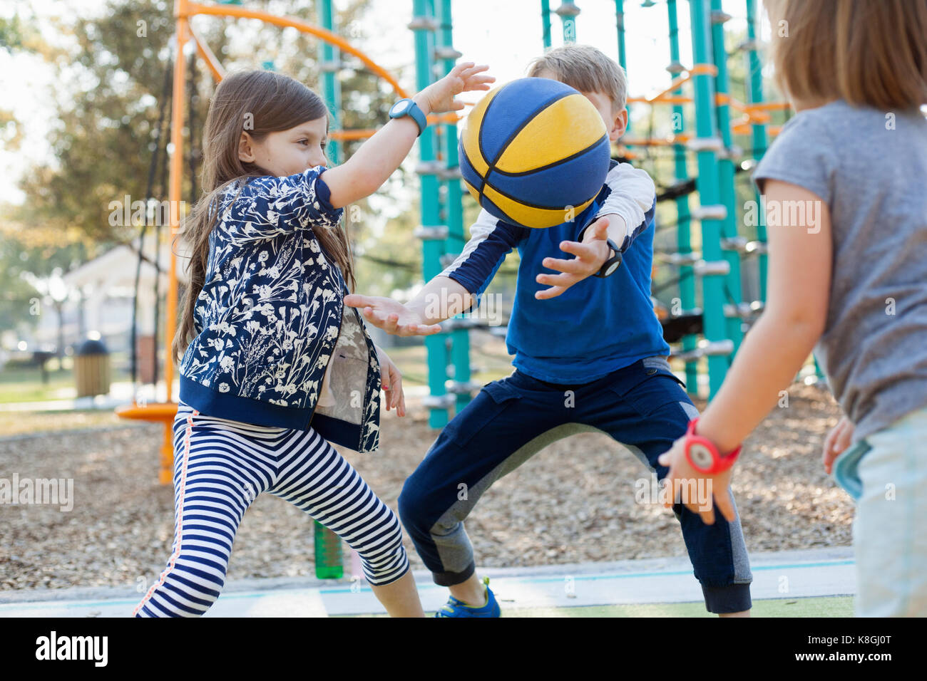 Children playing basketball in playground Stock Photo - Alamy