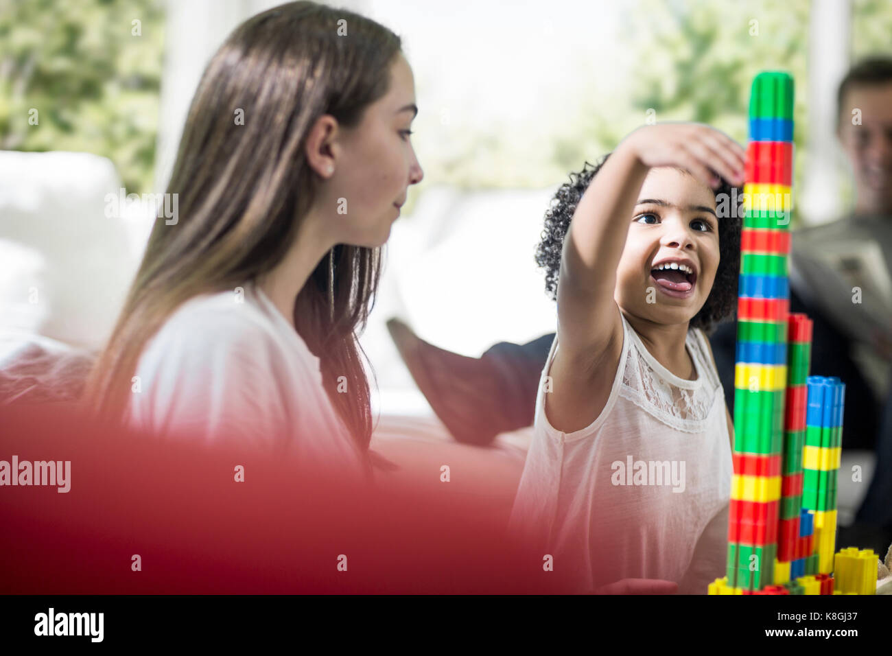 Family playing with building blocks Stock Photo - Alamy