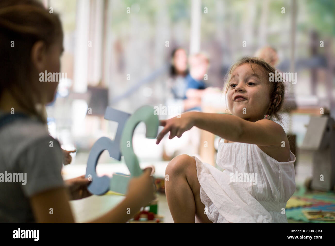 Children playing with number cutouts Stock Photo - Alamy