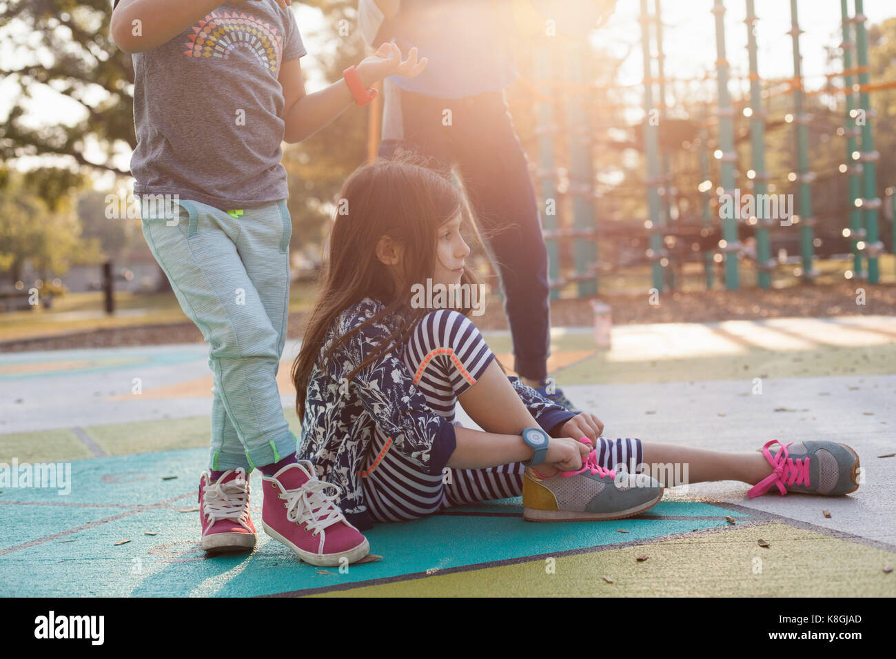 Children resting in playground Stock Photo - Alamy