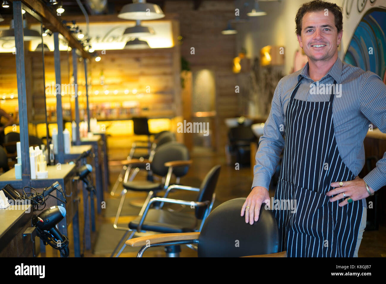 Happy salon owner Stock Photo - Alamy