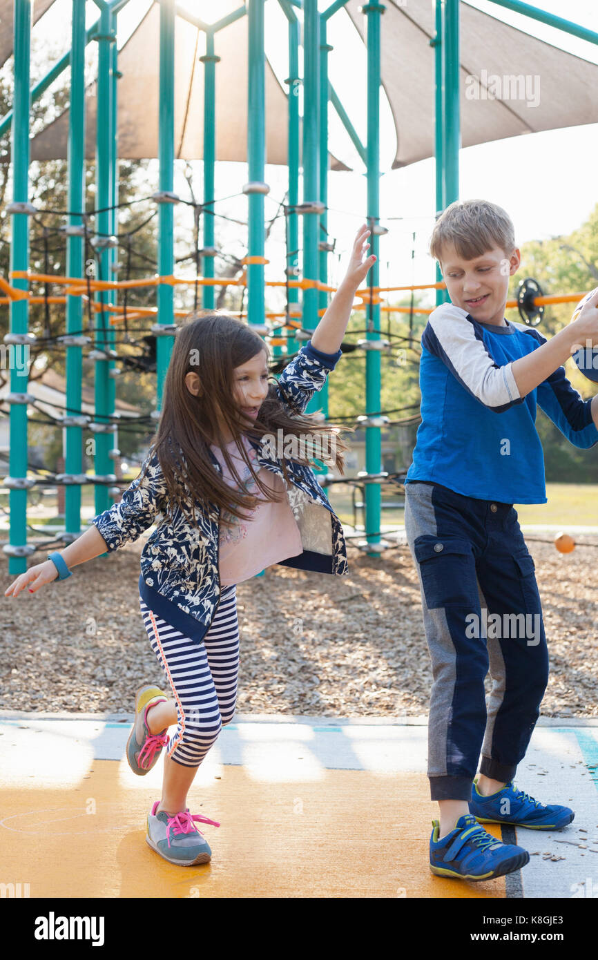 Children playing in playground Stock Photo - Alamy