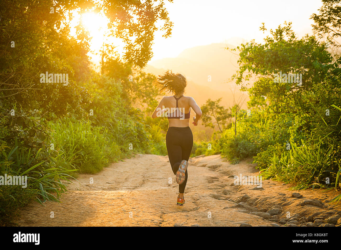 Runner training, rear view Stock Photo - Alamy