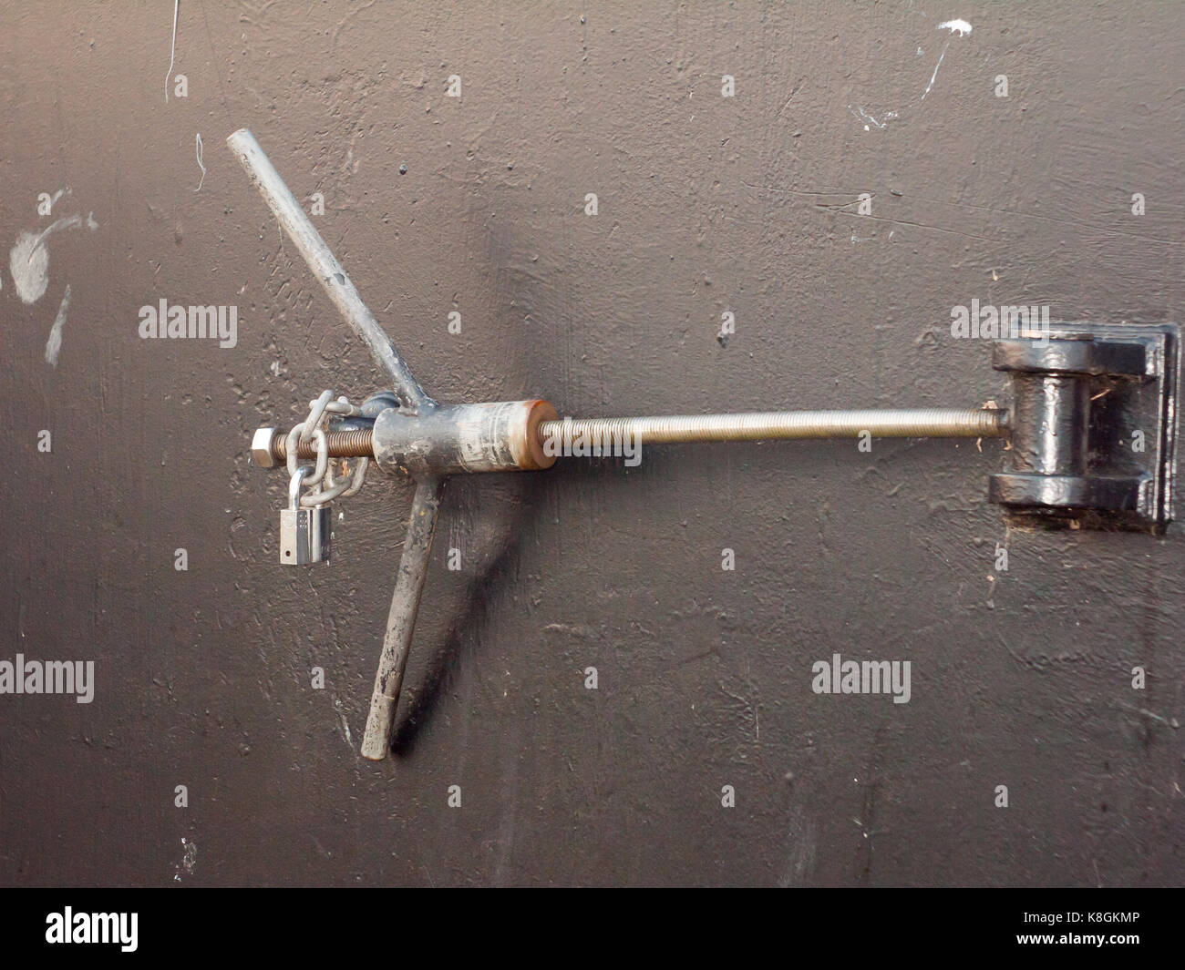 close up of long metal door lock on back of dock black doors Stock ...