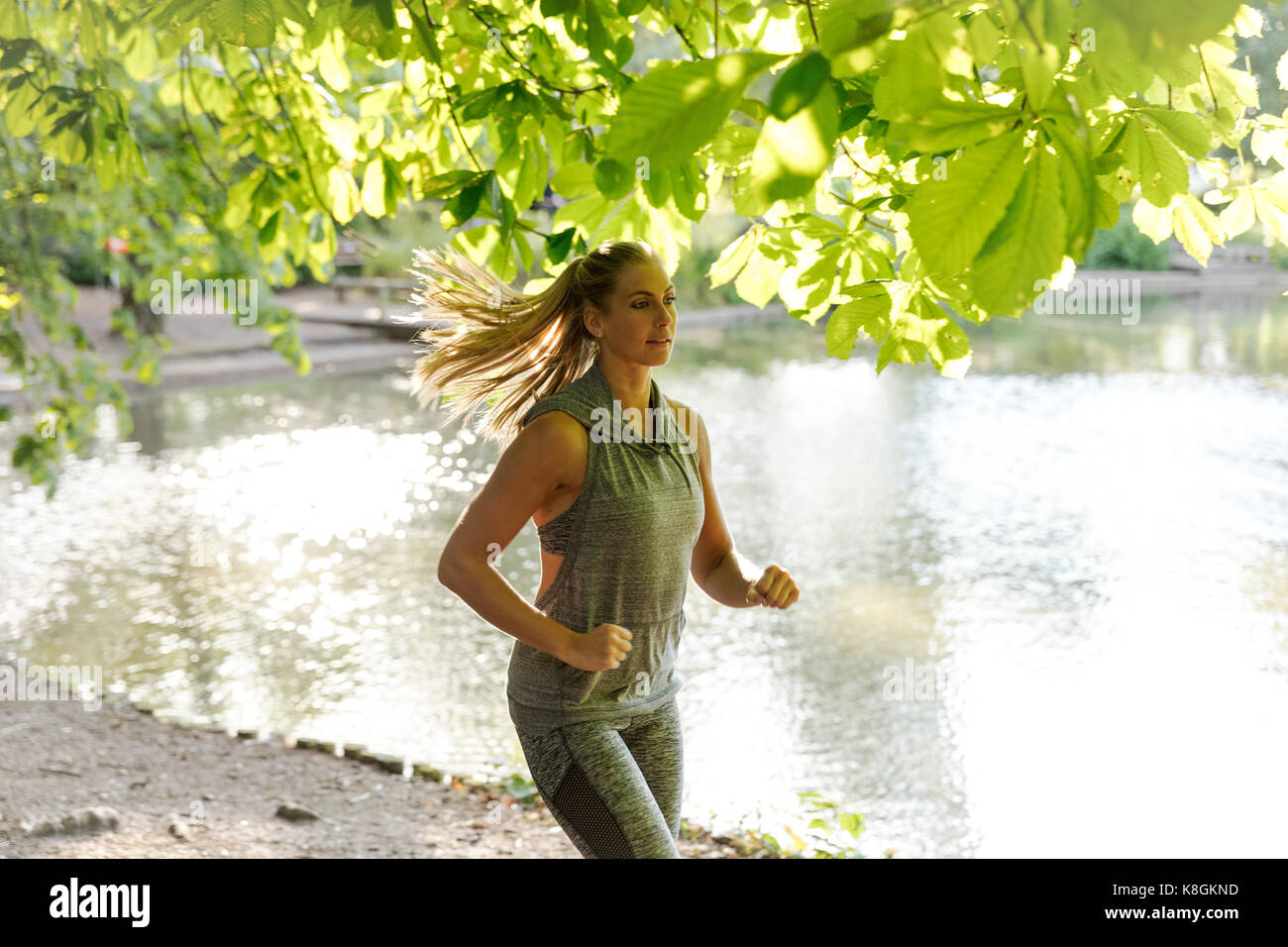 Female jogging park hi-res stock photography and images - Alamy