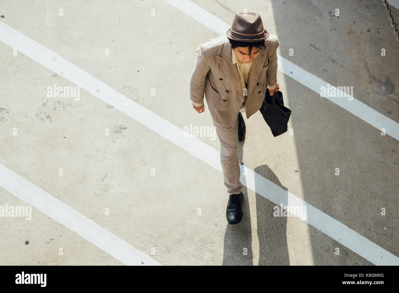 Young man go across road hi-res stock photography and images - Alamy