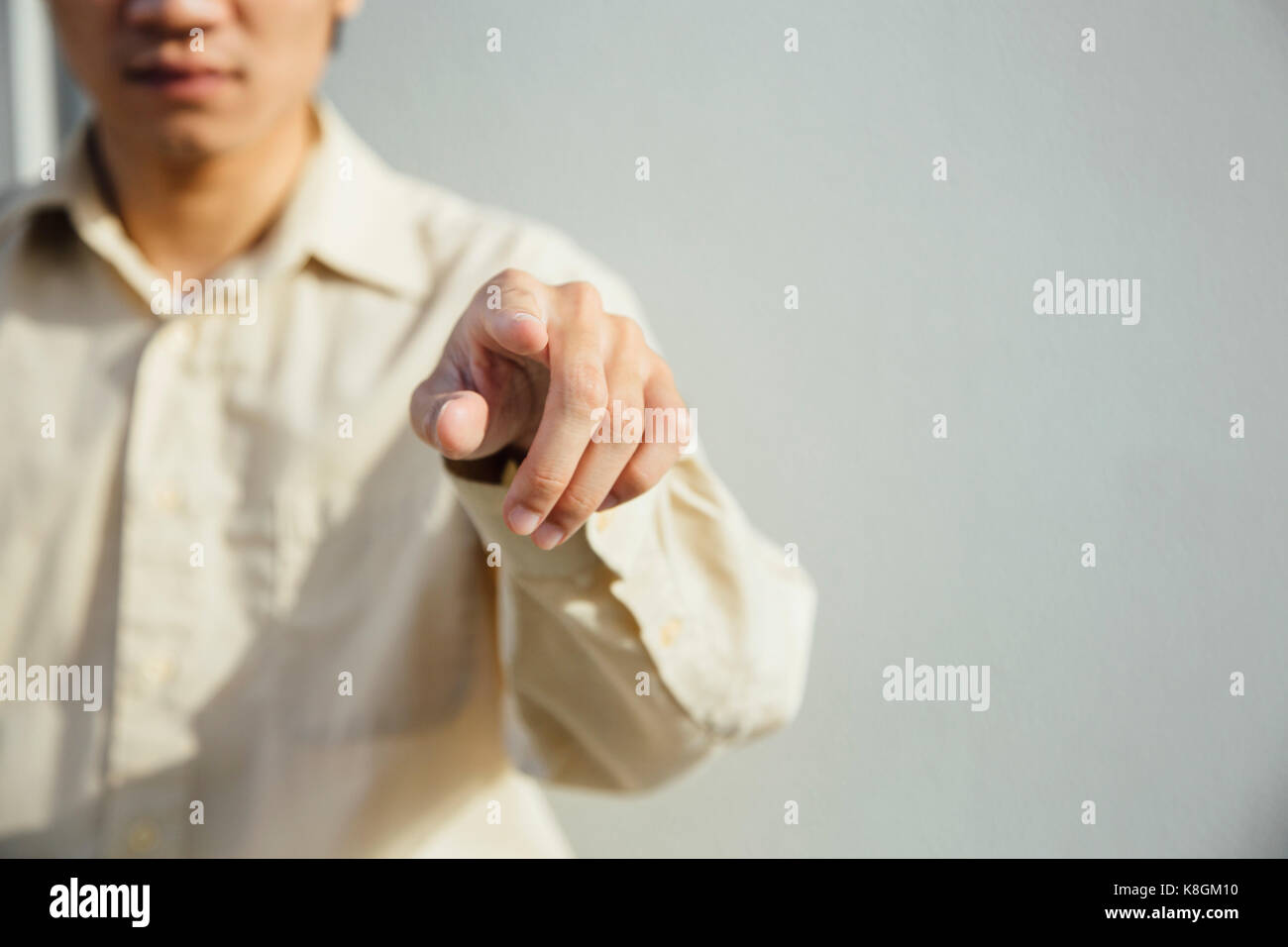Young man pointing at camera, mid section Stock Photo - Alamy