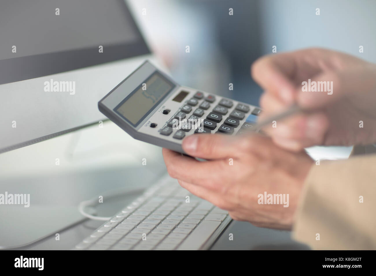 Man men male using calculator hi-res stock photography and images - Alamy