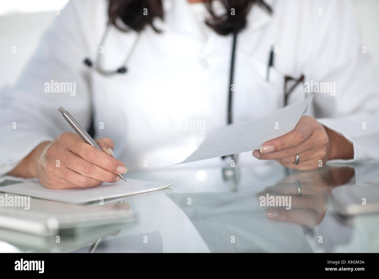 Cropped view of doctor writing prescription Stock Photo - Alamy