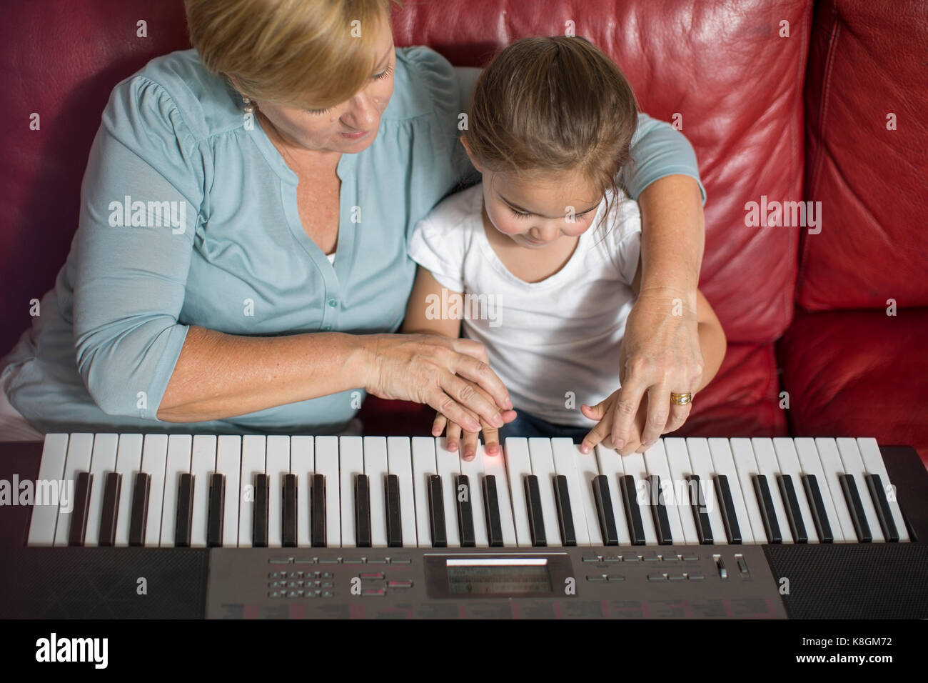 Mature woman keyboard music hi-res stock photography and images - Alamy