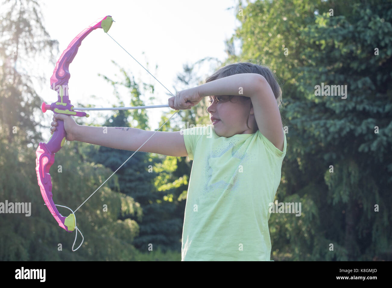 Playing Bow Arrow Girl Stock Photos & Playing Bow Arrow Girl Stock ...
