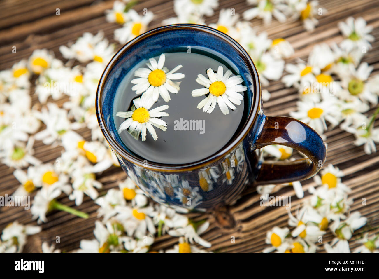 Chamomile tea in a blue cup Stock Photo - Alamy
