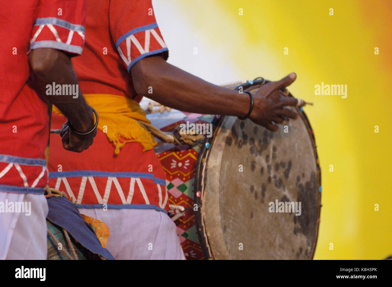 Two people playing drums and dancing Stock Photo - Alamy