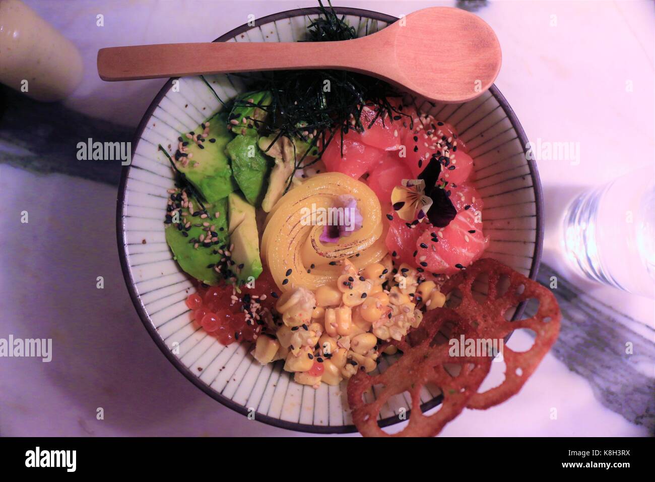 Fresh Asian style poke bowl at Kaia restaurant at the Ned, London Stock ...