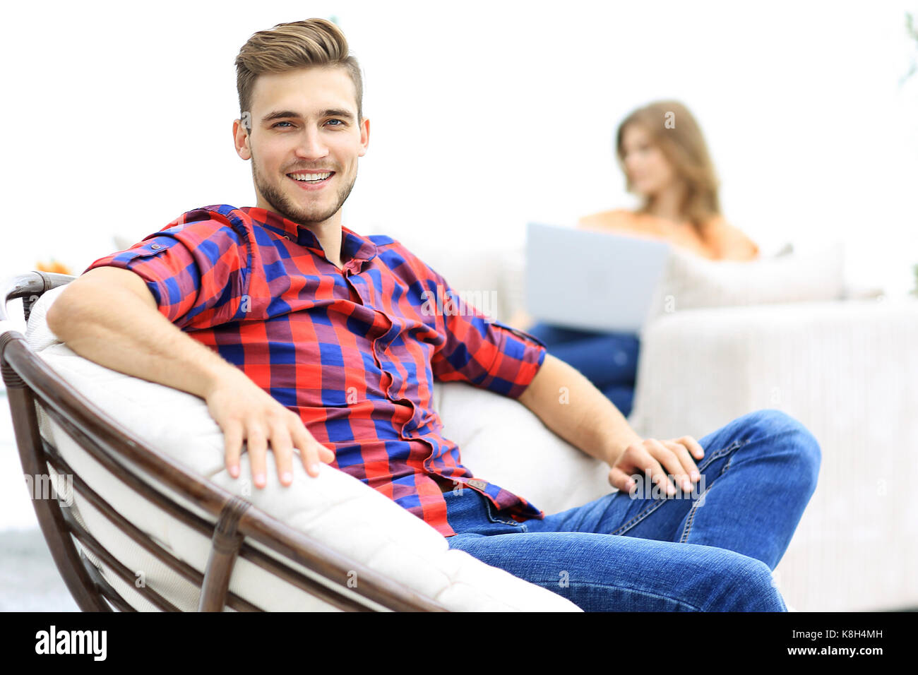 young man sitting in the big chair Stock Photo - Alamy
