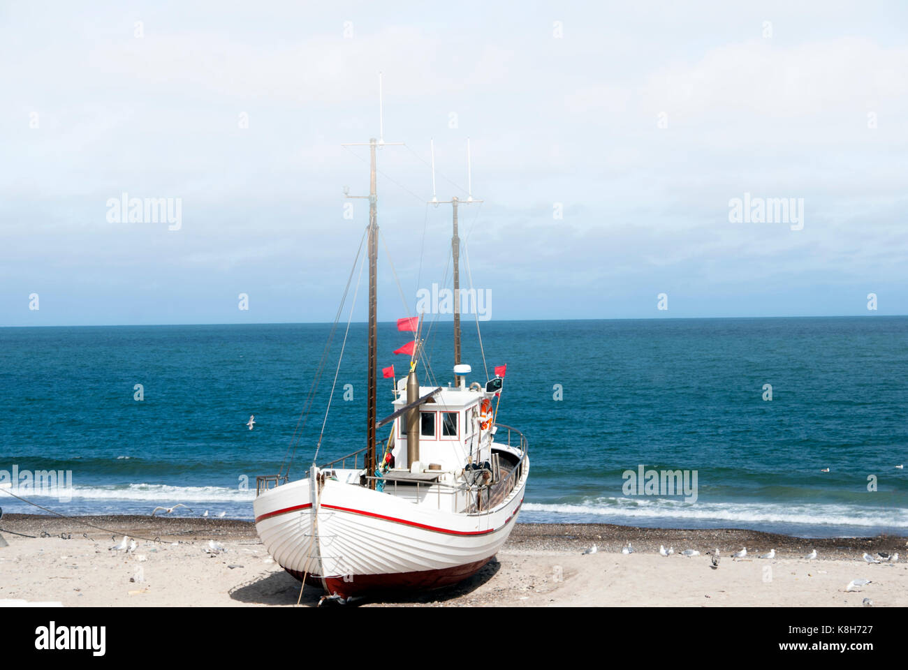 Fishing boat on the beach in Denmark Stock Photo - Alamy