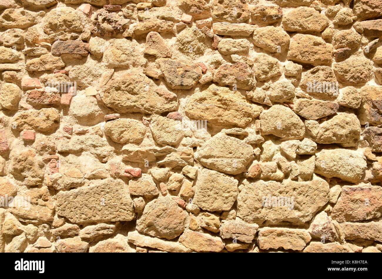 Stone wall in the medieval village of Pals, located in the middle of ...