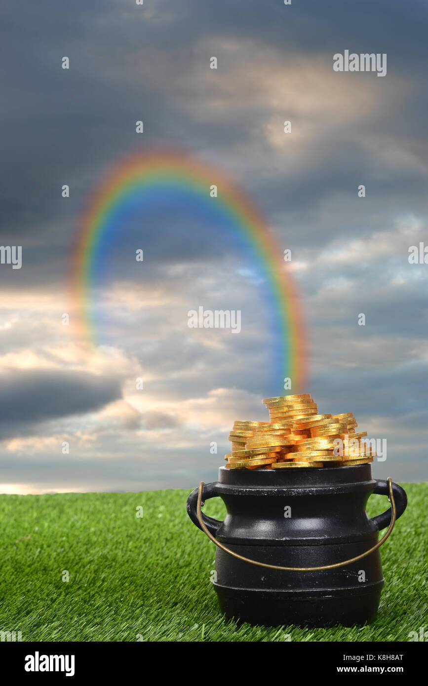rainbow leading to pot of gold Stock Photo - Alamy