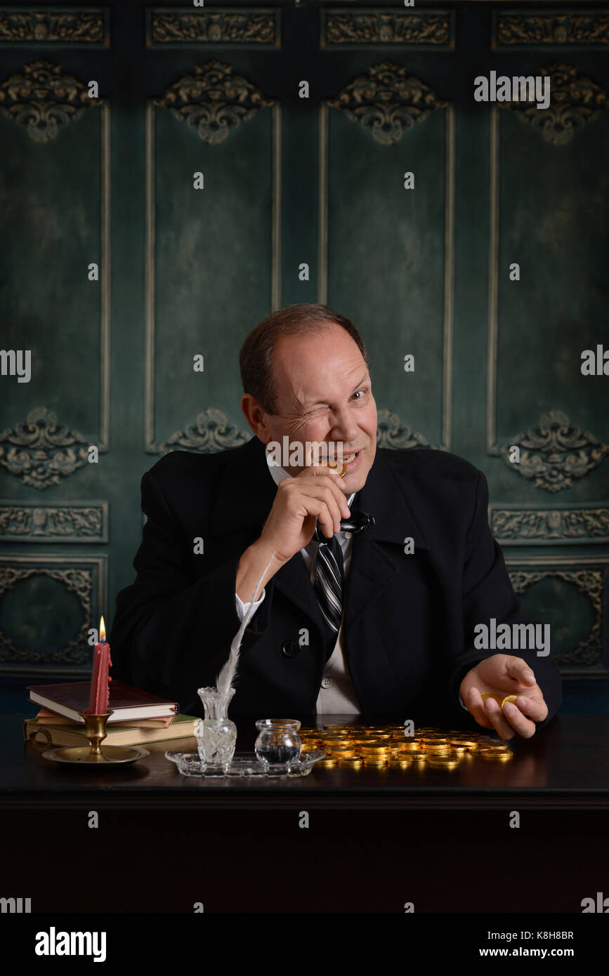 victorian buisness man biting gold coin Stock Photo - Alamy