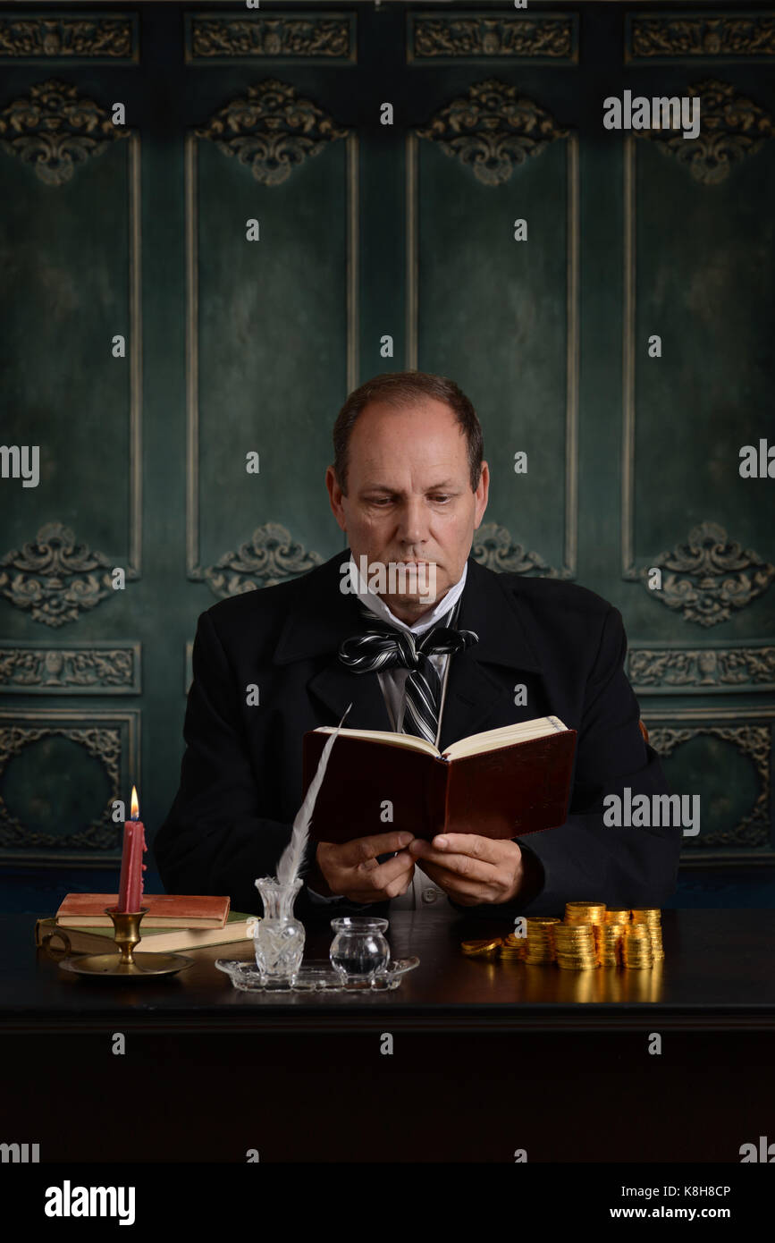 victorian buisness man reading is money ledger Stock Photo - Alamy