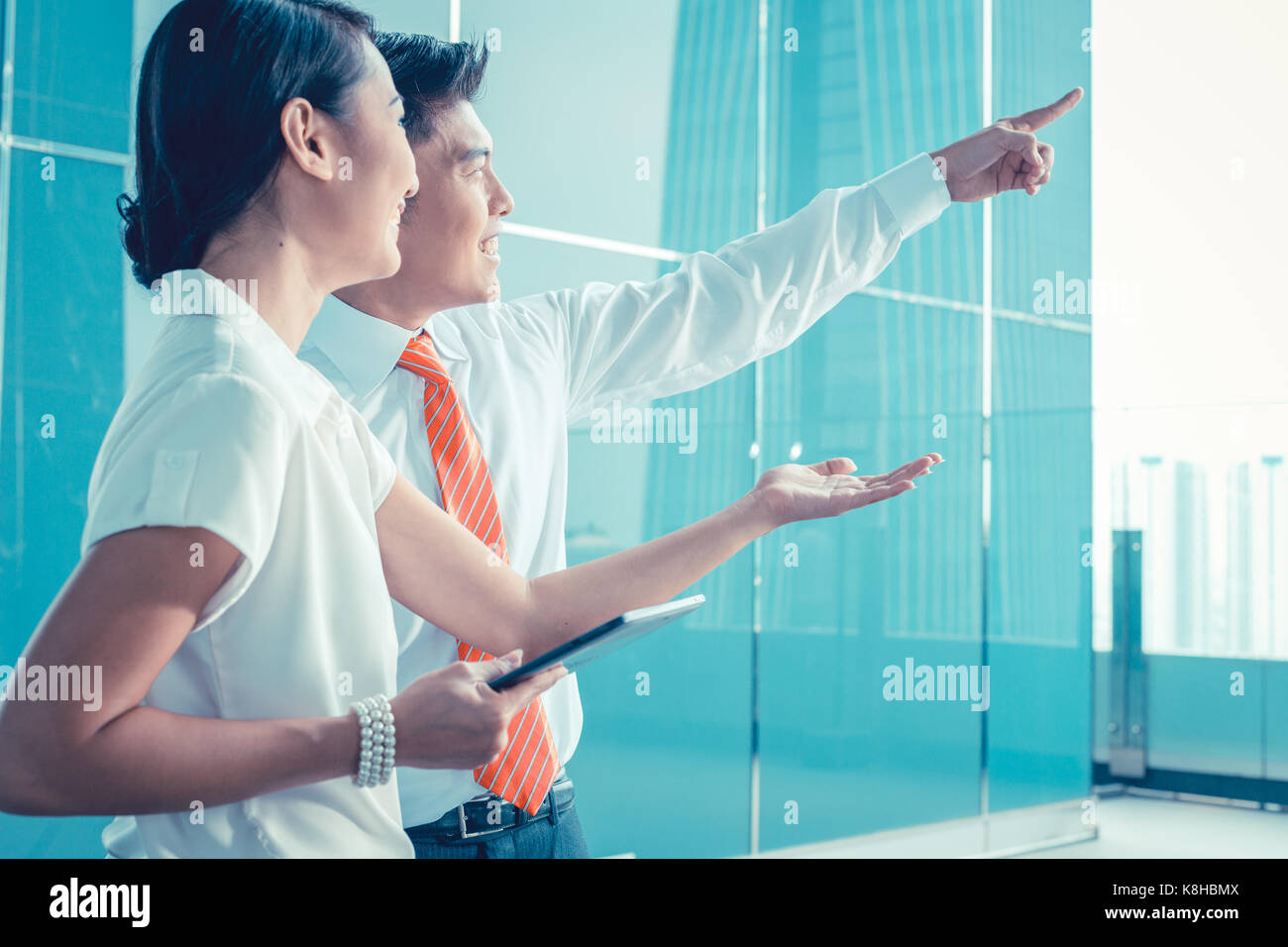 Chinese business man explaining his vision or idea to colleague Stock ...