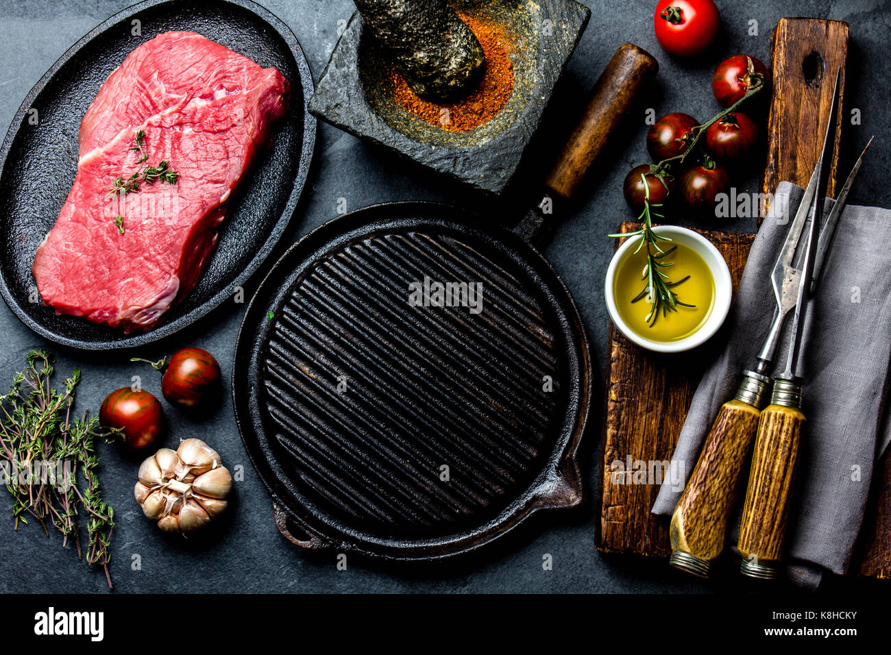 Raw fresh meat steak beef tenderloin, herbs and spices around frying ...
