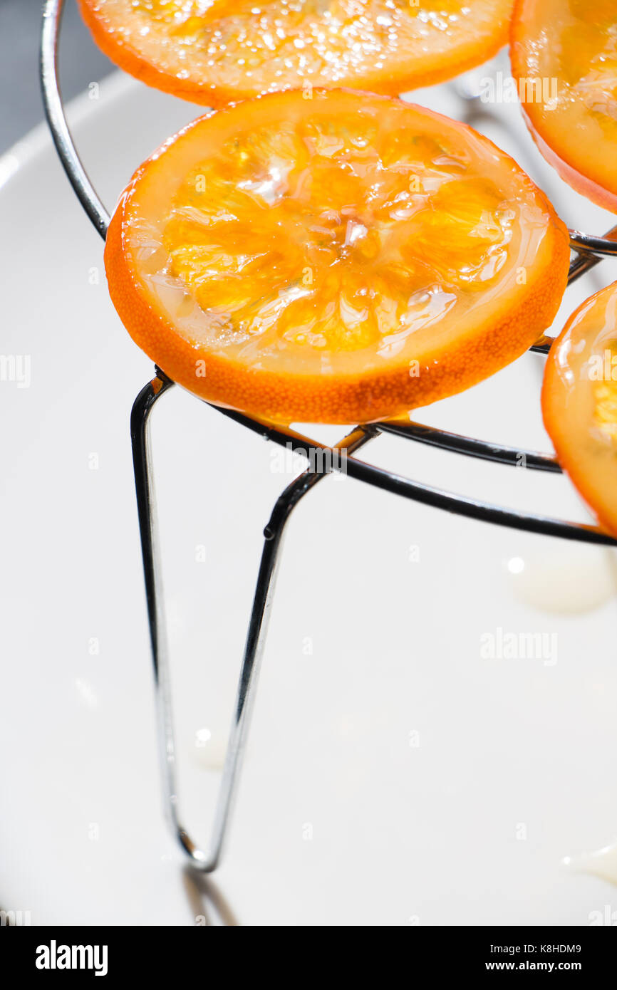 Slices of candied orange dripping in a grid Stock Photo - Alamy