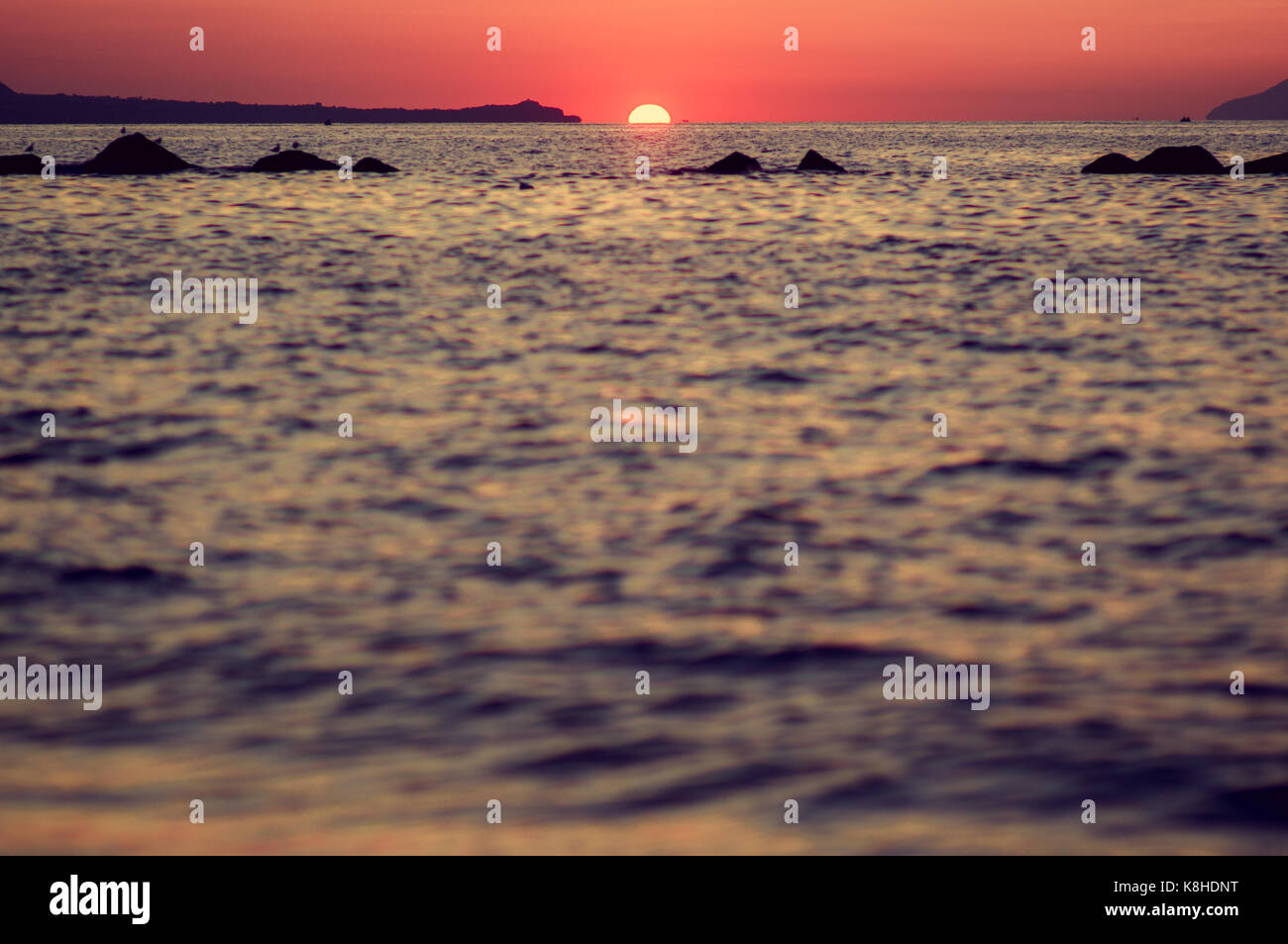 Sunset over the sea Stock Photo - Alamy