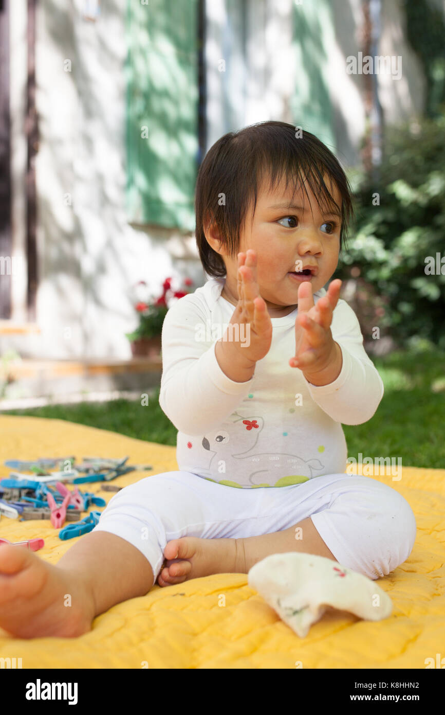 Baby girl clapping hands hi-res stock photography and images - Alamy